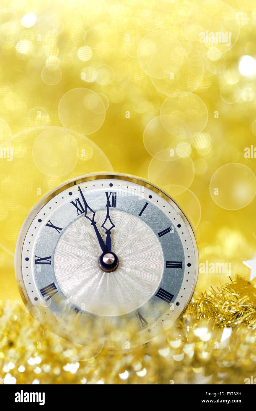 Happy New Year. Old clock on yellow abstract background Stock Photo - Alamy