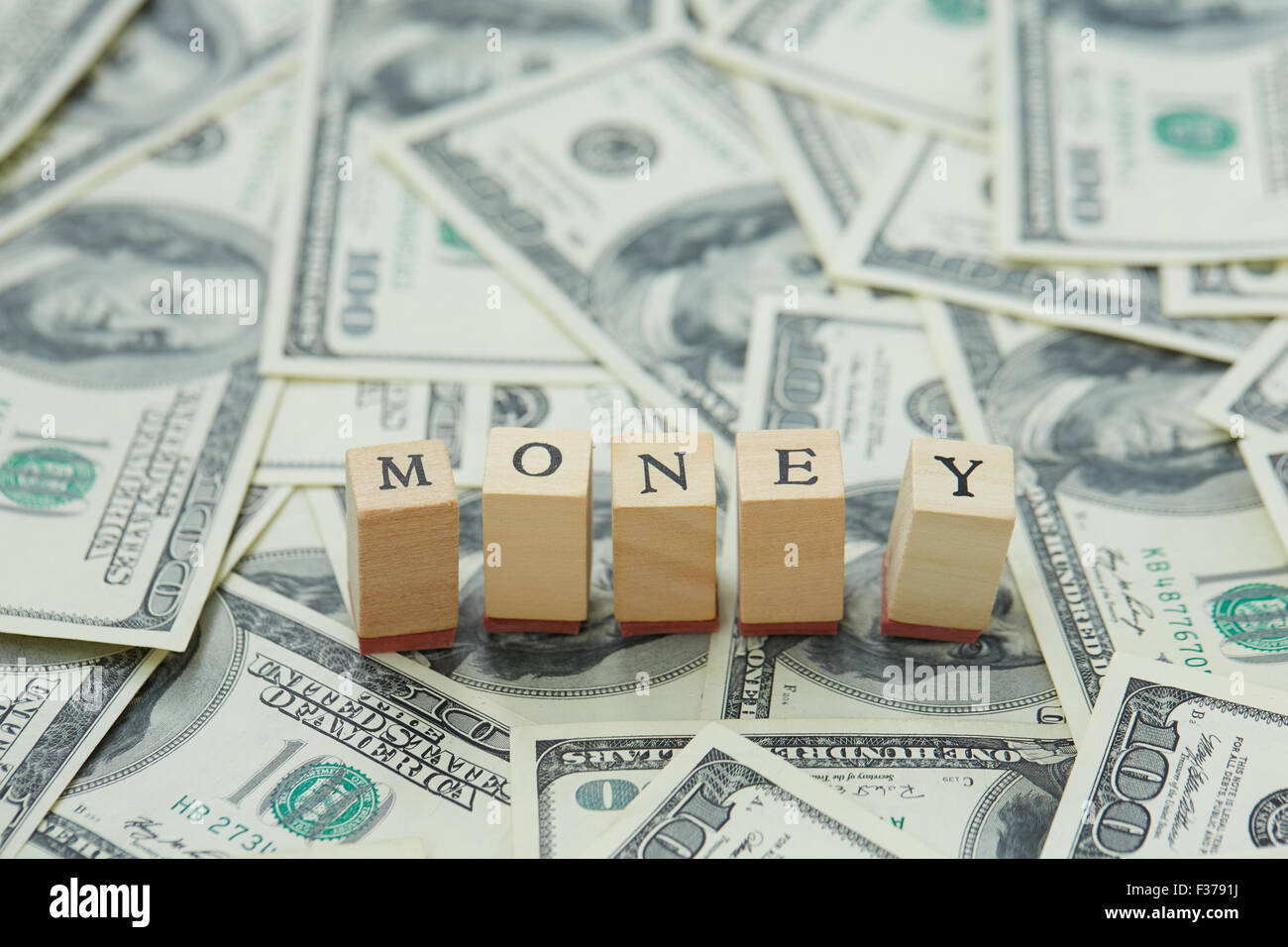 much money. Wooden blocks - the inscription money Stock Photo - Alamy