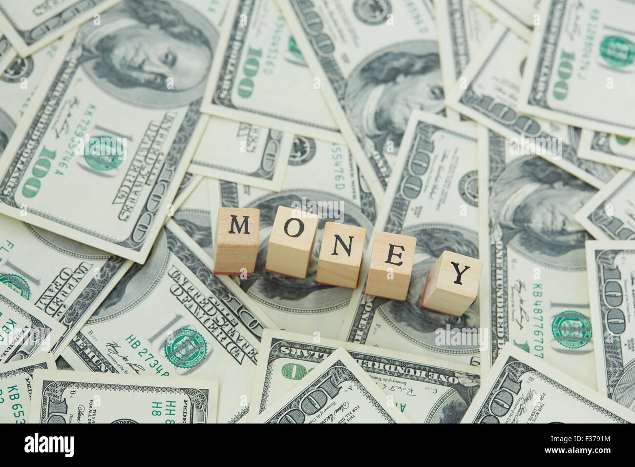 much money. Wooden blocks - the inscription money Stock Photo - Alamy