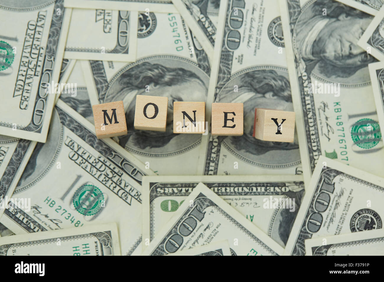 much money. Wooden blocks - the inscription money Stock Photo - Alamy