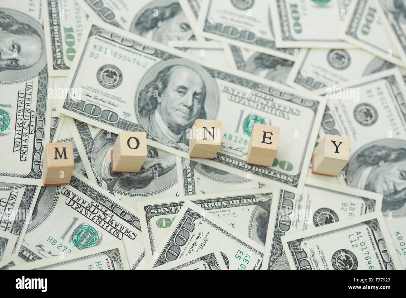 much money. Wooden blocks - the inscription money Stock Photo - Alamy