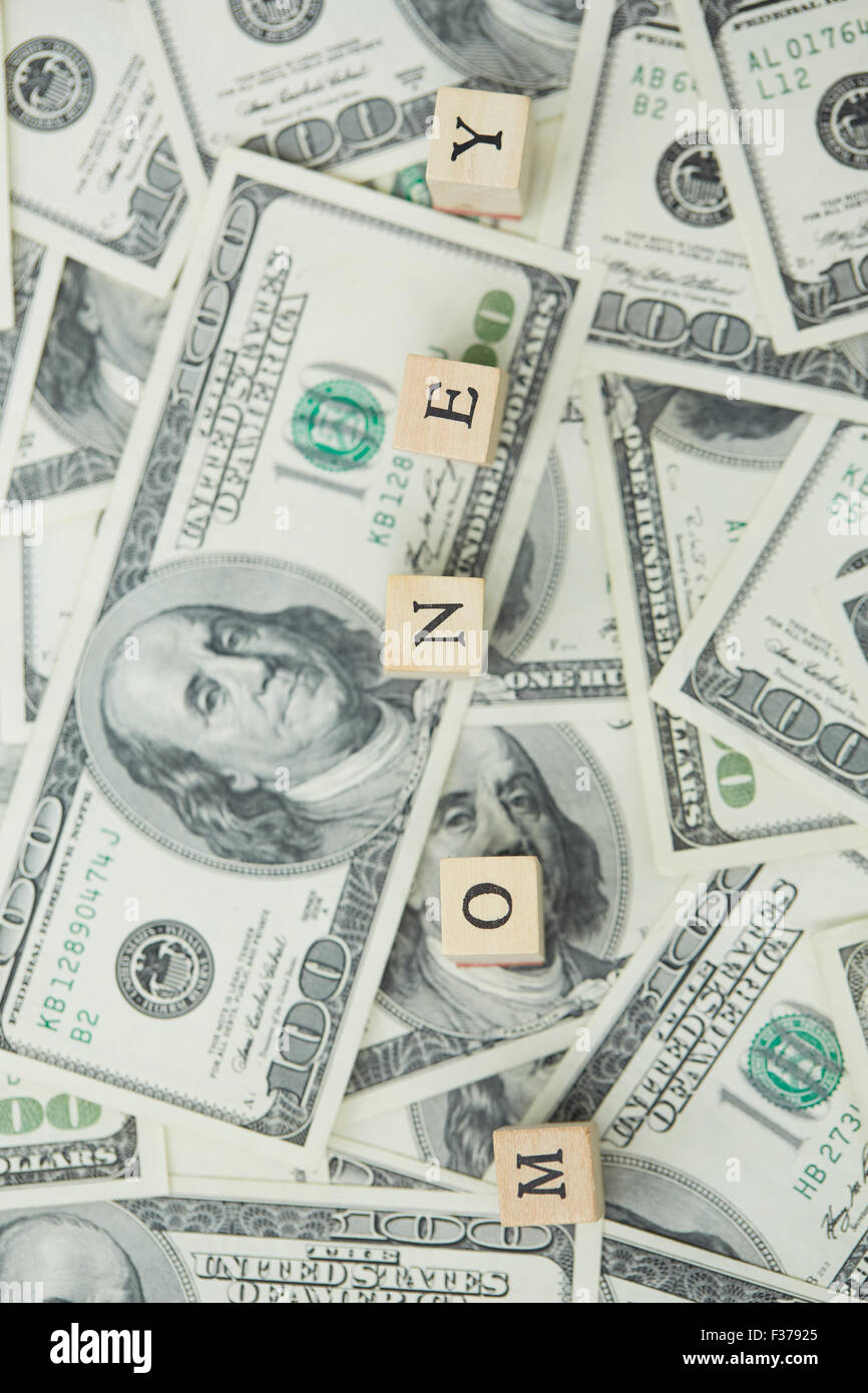 much money. Wooden blocks - the inscription money Stock Photo - Alamy