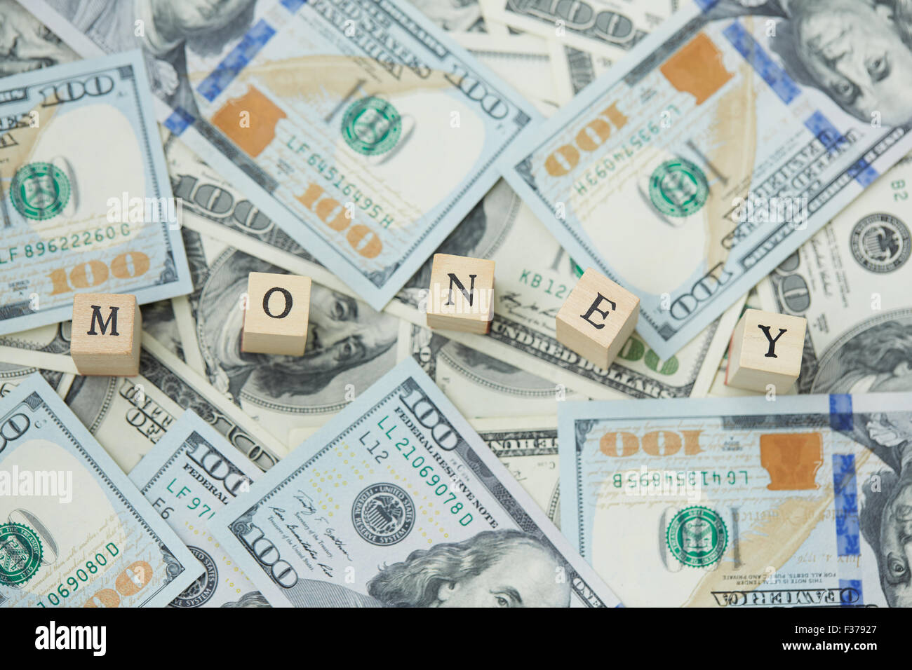 much money. Wooden blocks - the inscription money Stock Photo - Alamy