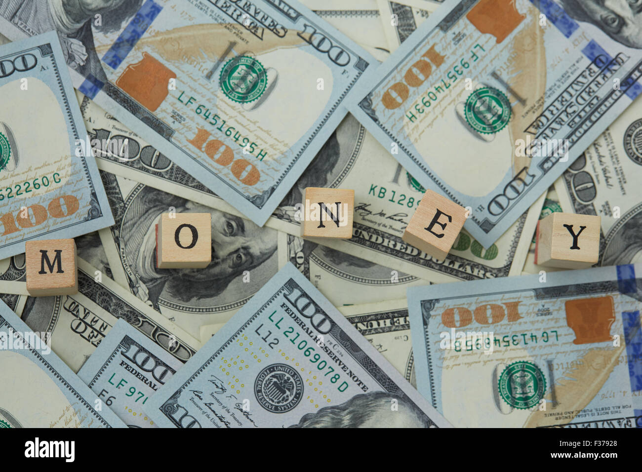 much money. Wooden blocks - the inscription money Stock Photo - Alamy