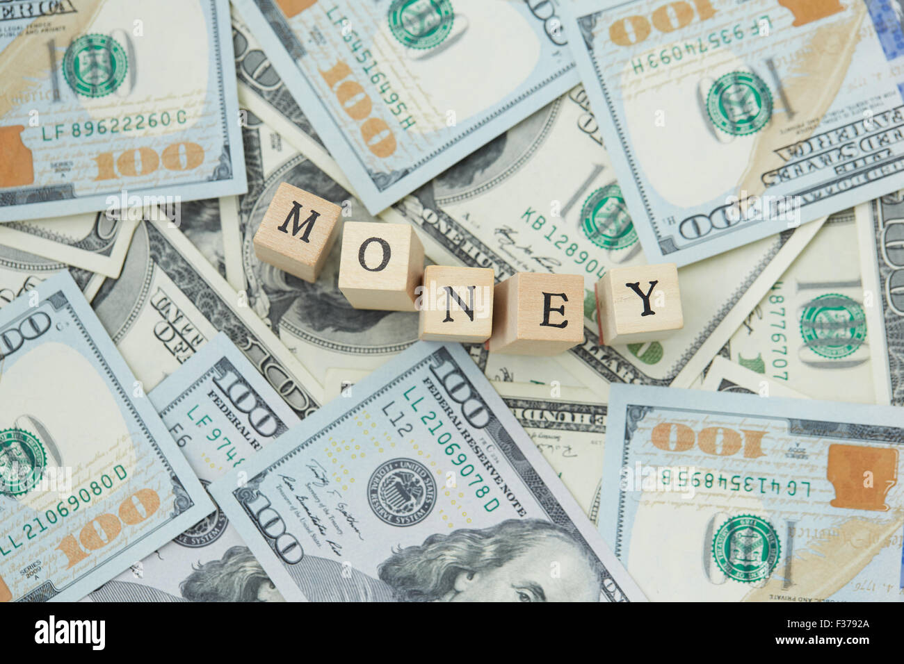 much money. Wooden blocks - the inscription money Stock Photo - Alamy