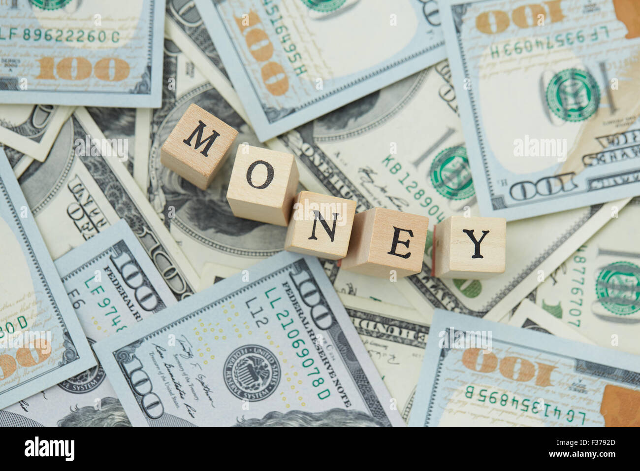 much money. Wooden blocks - the inscription money Stock Photo - Alamy