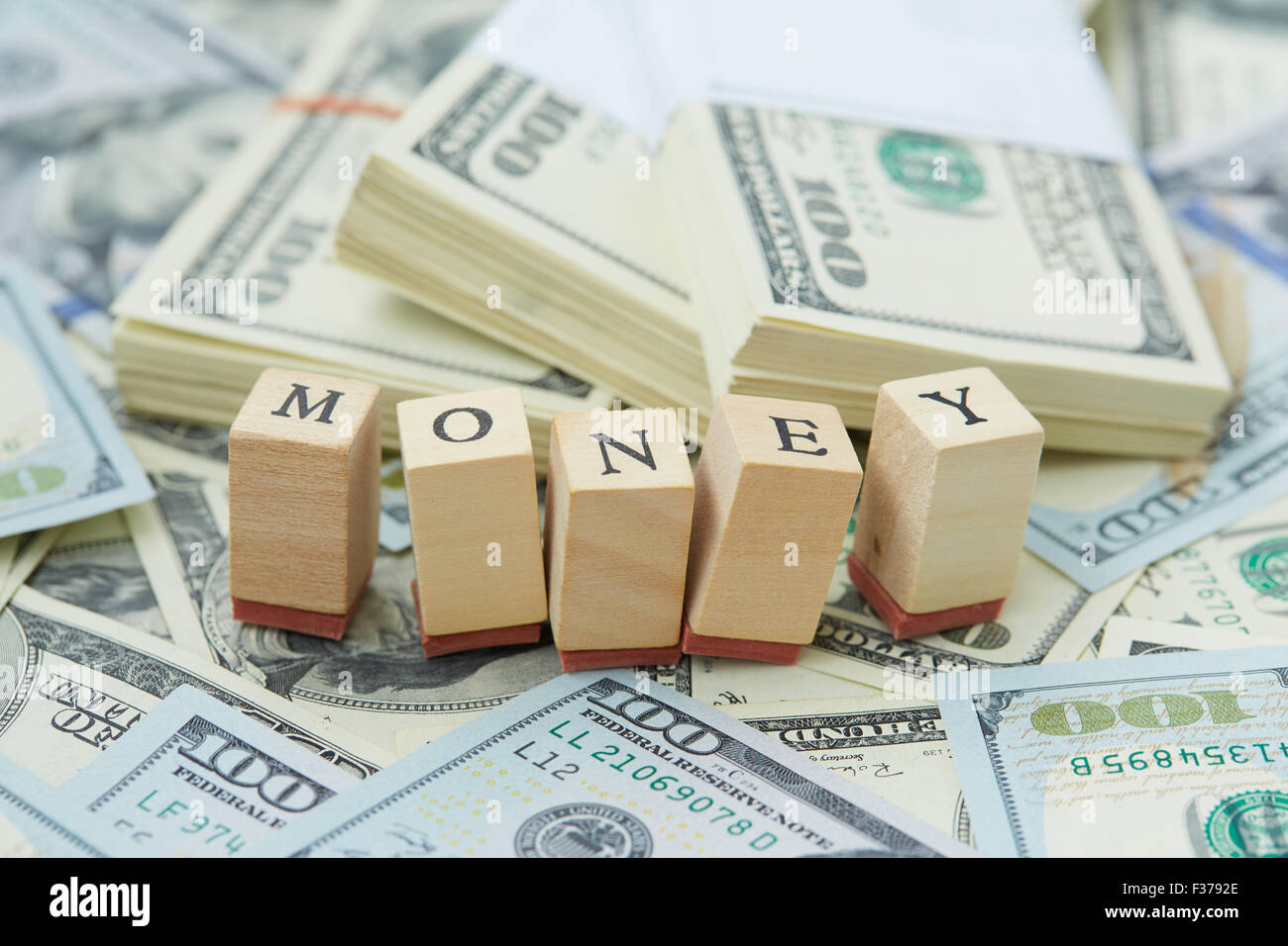 much money. Wooden blocks - the inscription money Stock Photo - Alamy