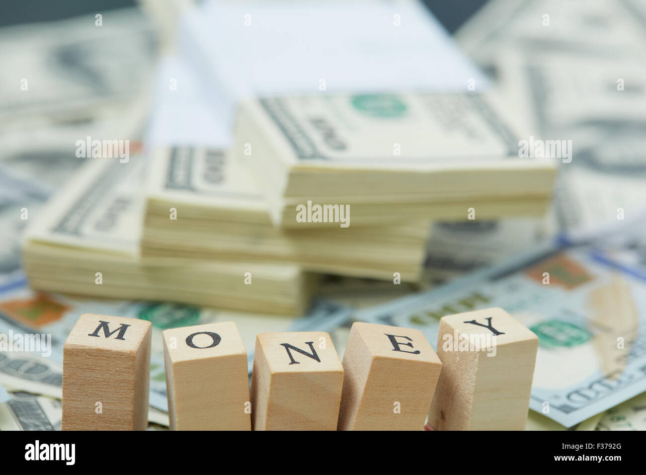 much money. Wooden blocks - the inscription money Stock Photo - Alamy