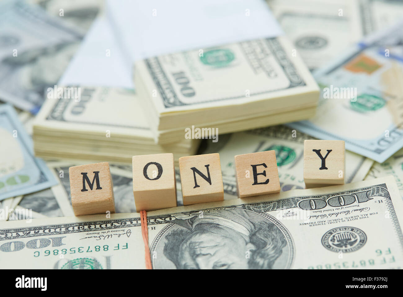 much money. Wooden blocks - the inscription money Stock Photo - Alamy