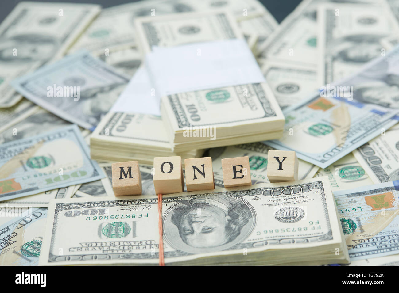 much money. Wooden blocks - the inscription money Stock Photo - Alamy