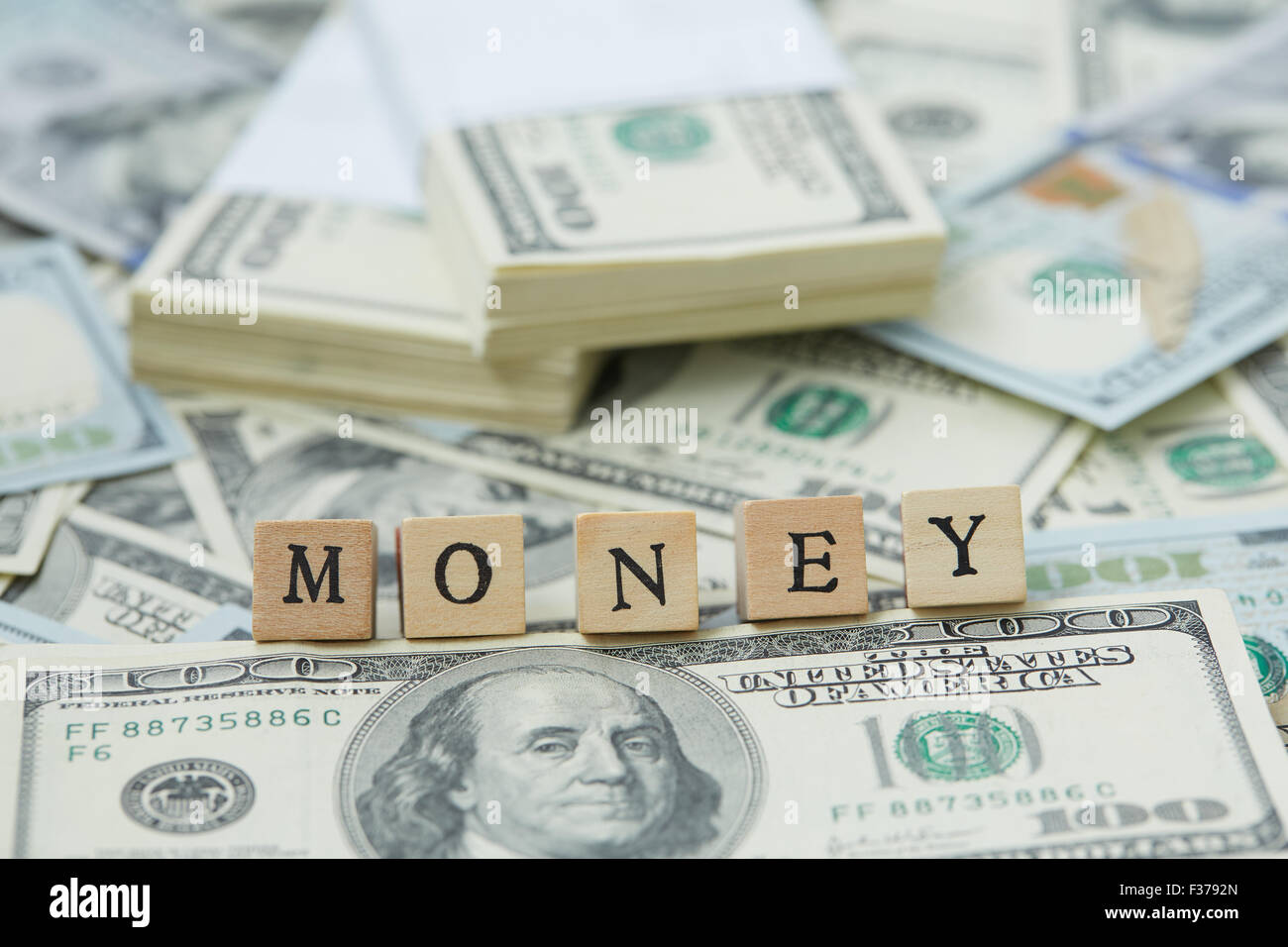 much money. Wooden blocks - the inscription money Stock Photo - Alamy