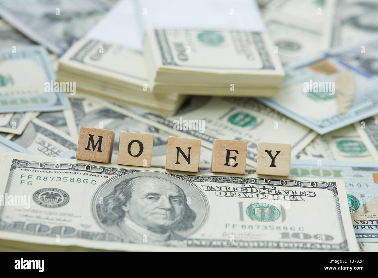 much money. Wooden blocks - the inscription money Stock Photo - Alamy
