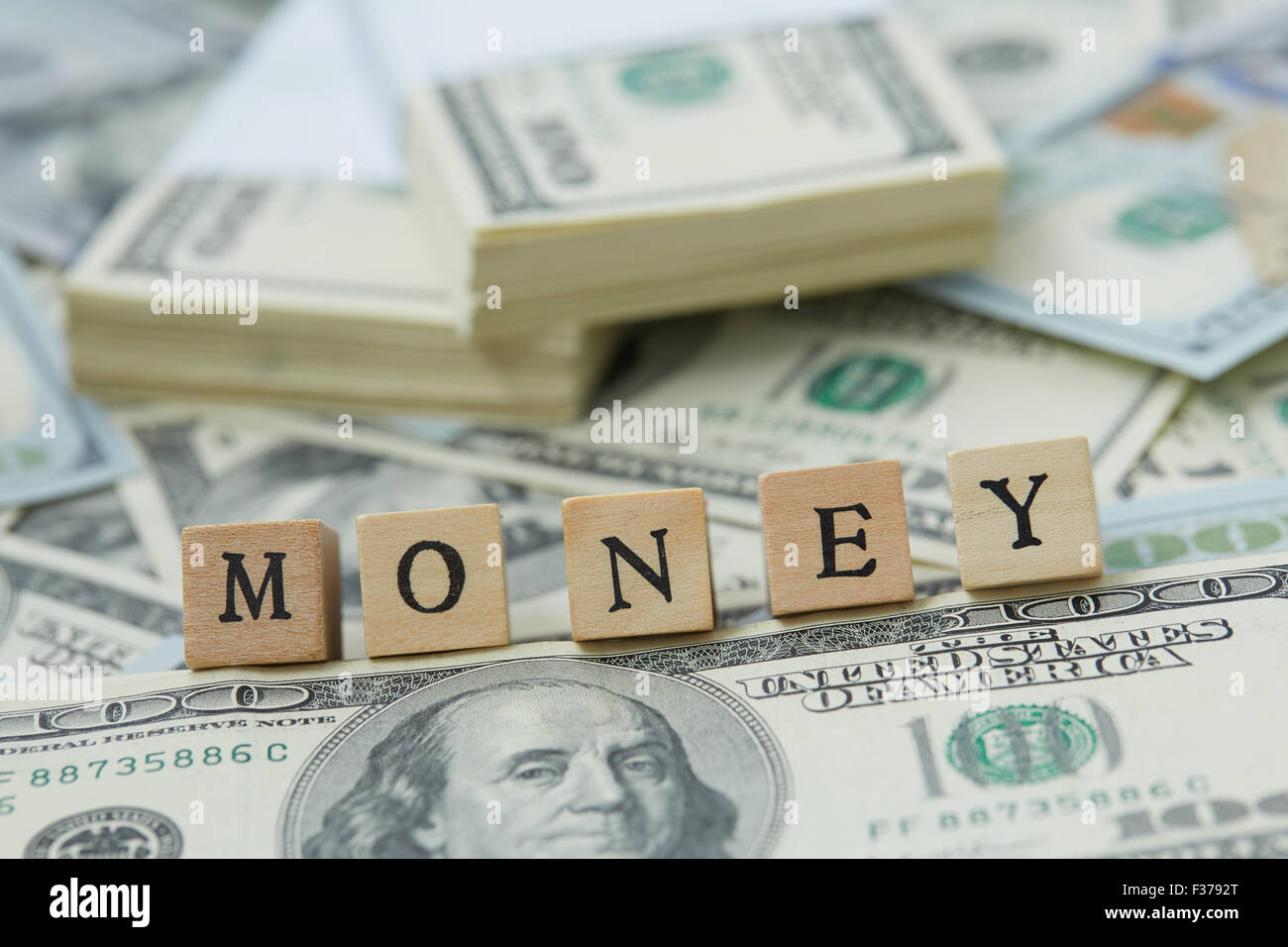 much money. Wooden blocks - the inscription money Stock Photo - Alamy