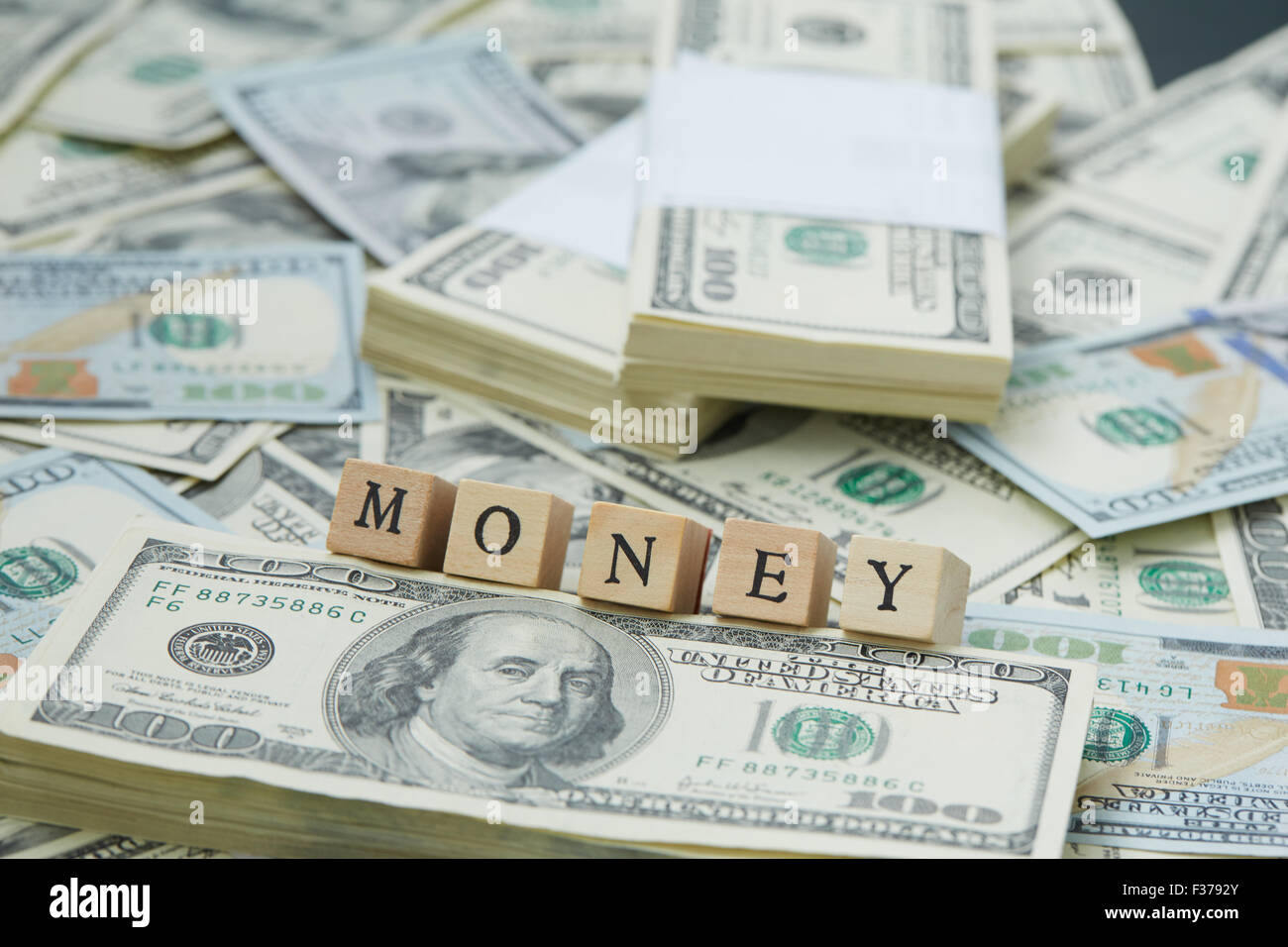 much money. Wooden blocks - the inscription money Stock Photo - Alamy