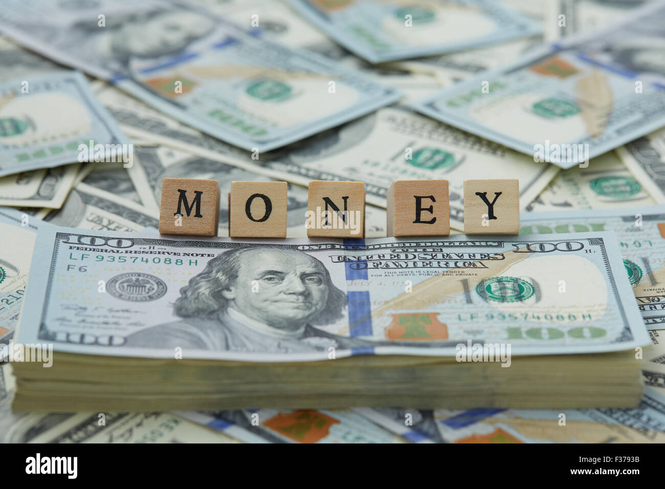 much money. Wooden blocks - the inscription money Stock Photo - Alamy
