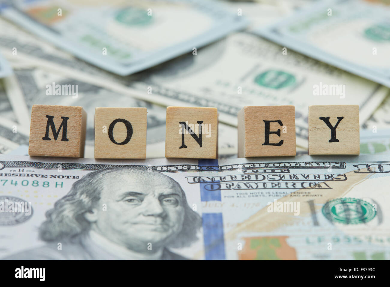 much money. Wooden blocks - the inscription money Stock Photo - Alamy