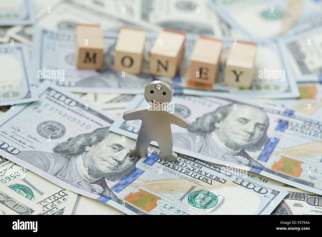 much money, money the inscription, a figure little man Stock Photo - Alamy
