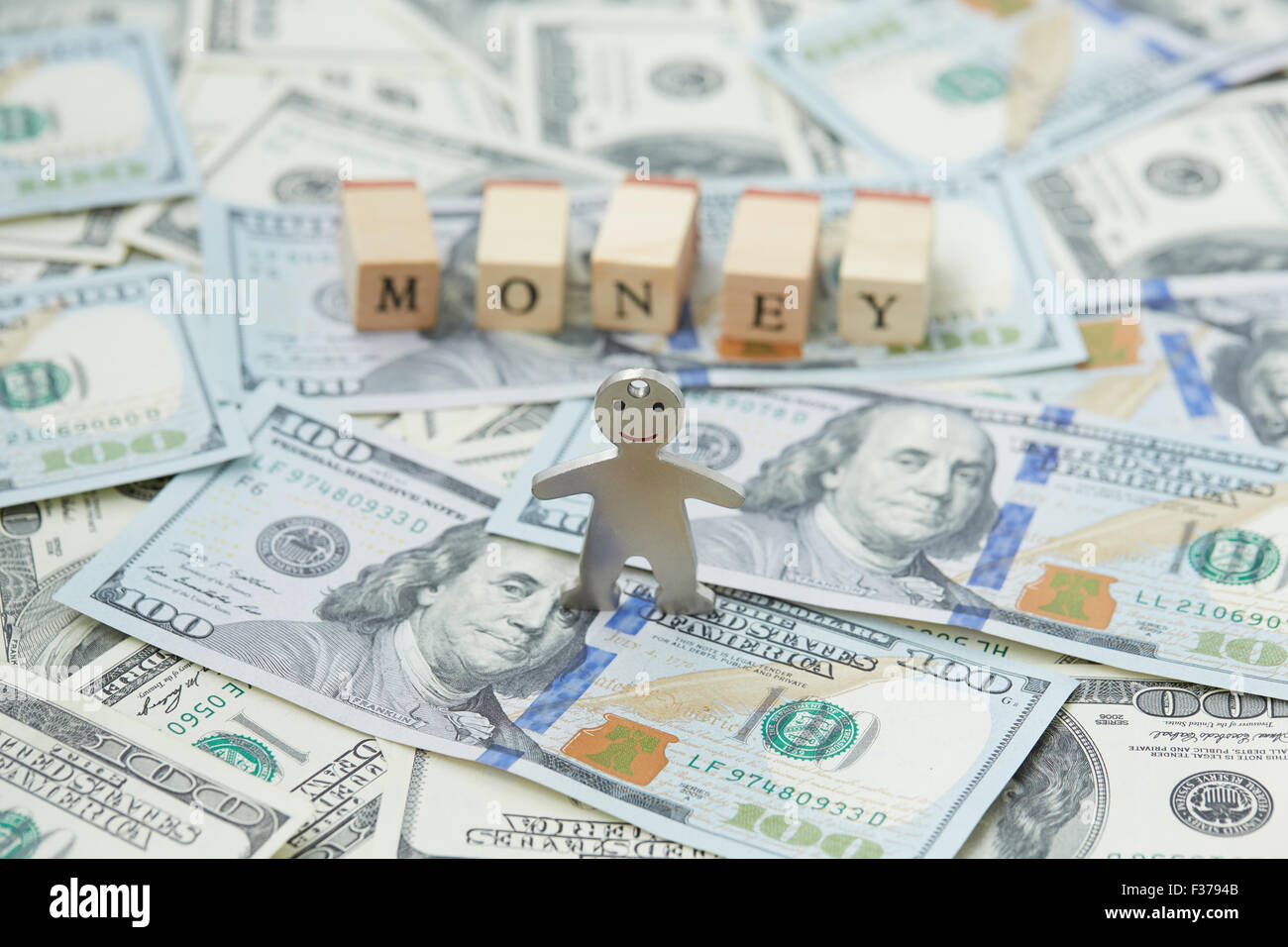 much money, money the inscription, a figure little man Stock Photo - Alamy