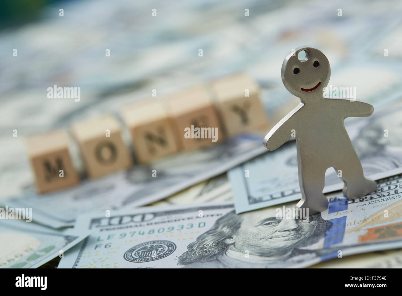 much money, money the inscription, a figure little man Stock Photo - Alamy