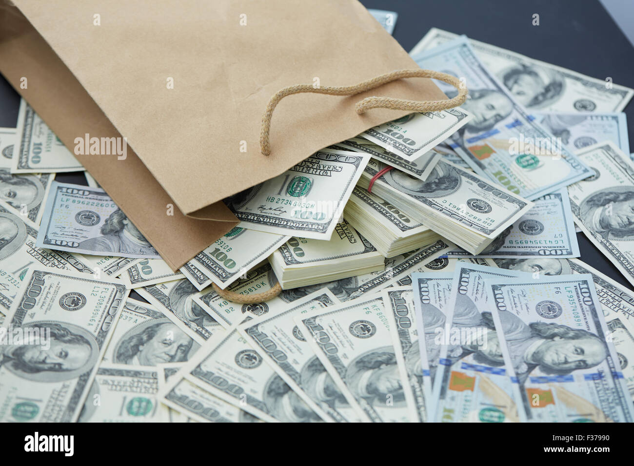 a lot of money out of a paper bag Stock Photo - Alamy