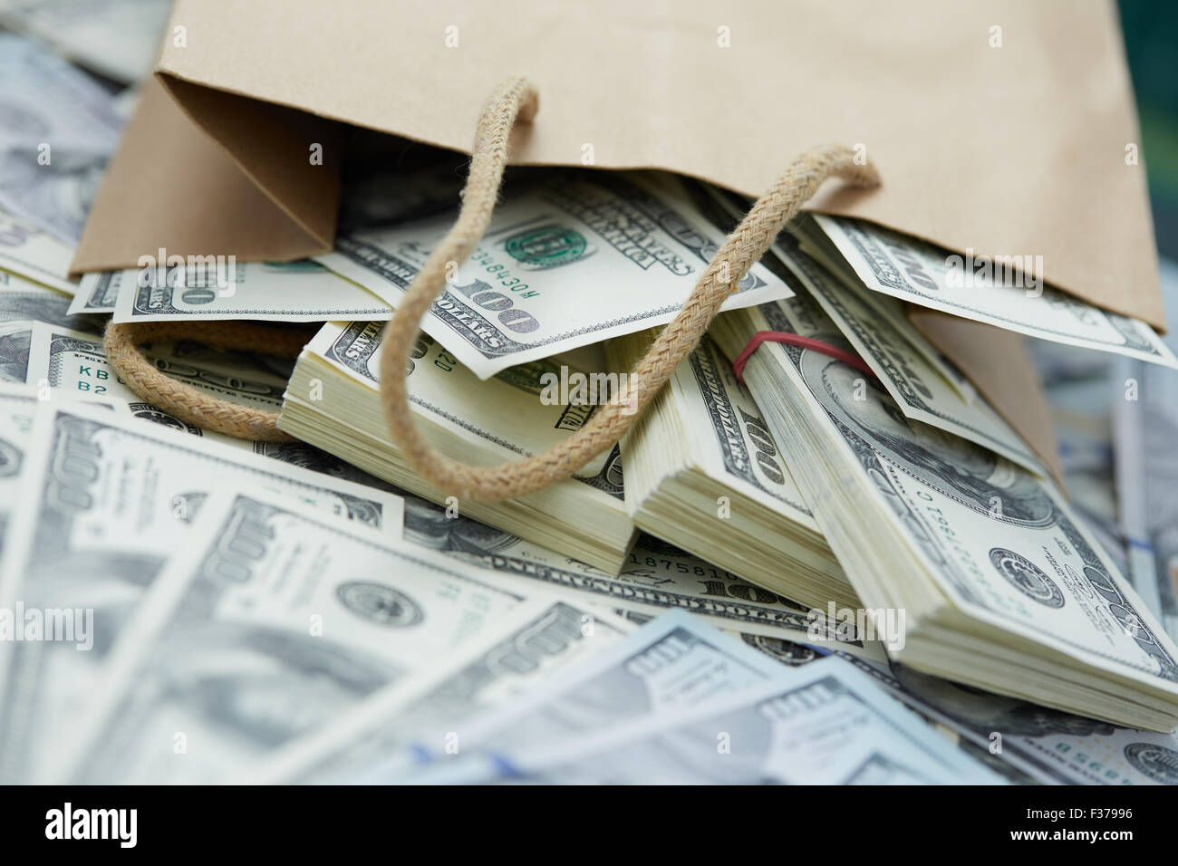 a lot of money out of a paper bag Stock Photo - Alamy