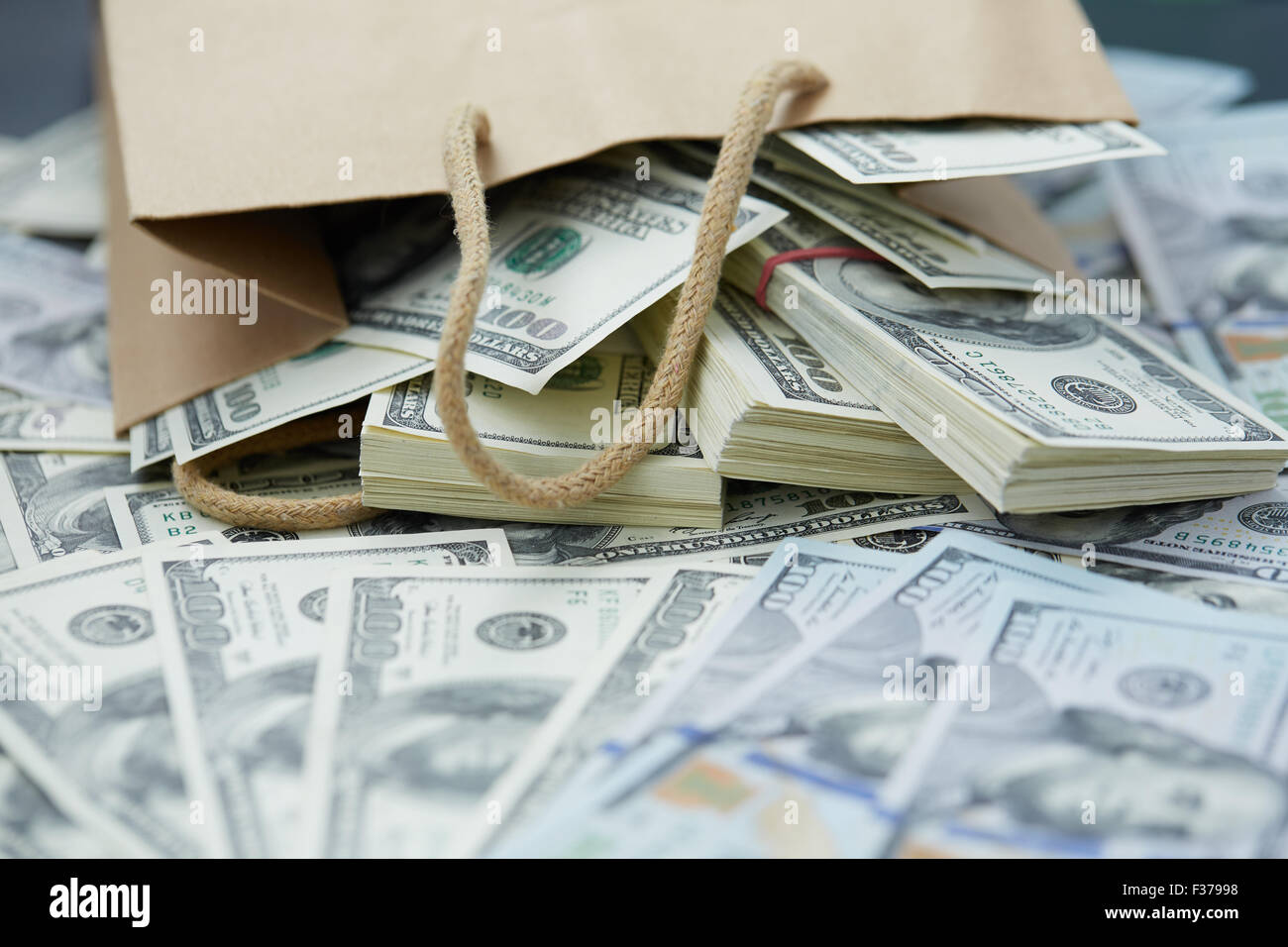 a lot of money out of a paper bag Stock Photo - Alamy