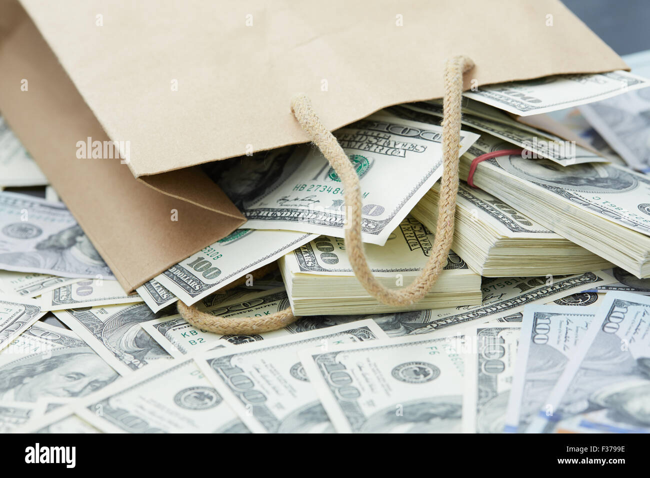 a lot of money out of a paper bag Stock Photo - Alamy