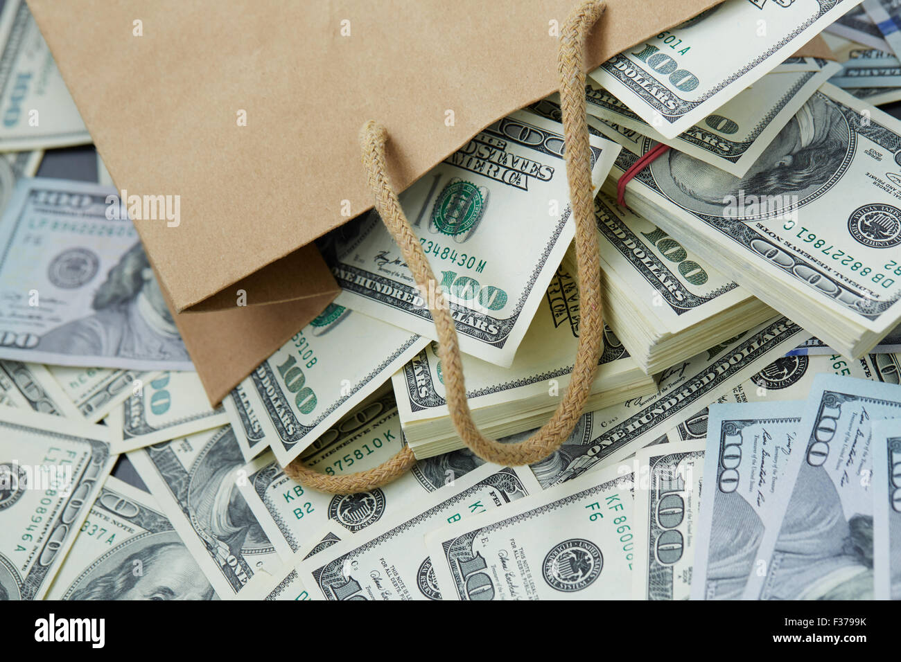 a lot of money out of a paper bag Stock Photo - Alamy