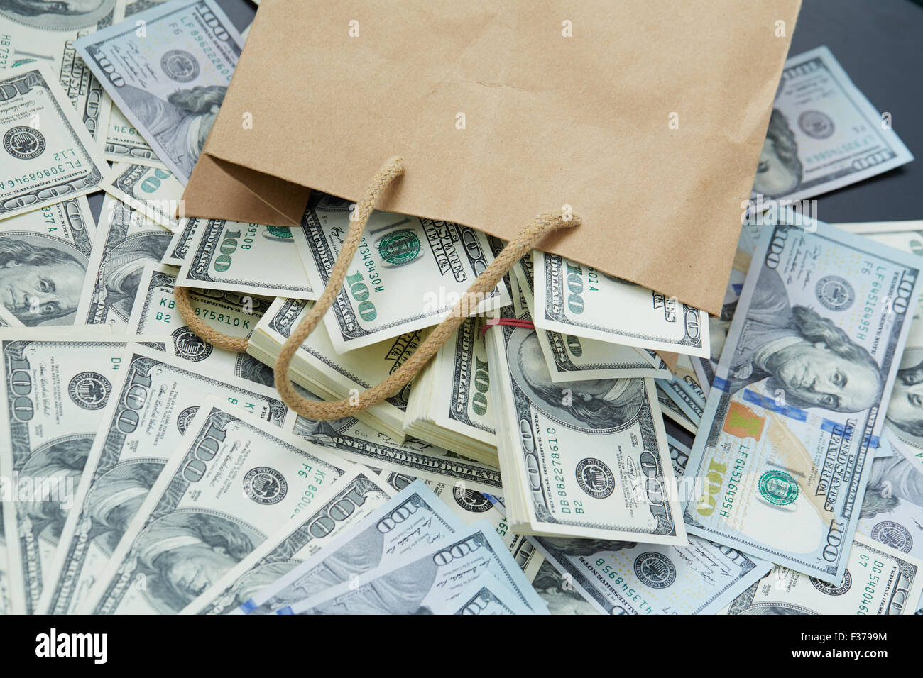 a lot of money out of a paper bag Stock Photo - Alamy