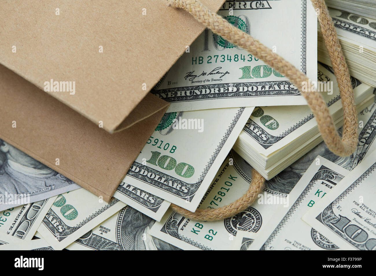 a lot of money out of a paper bag Stock Photo - Alamy