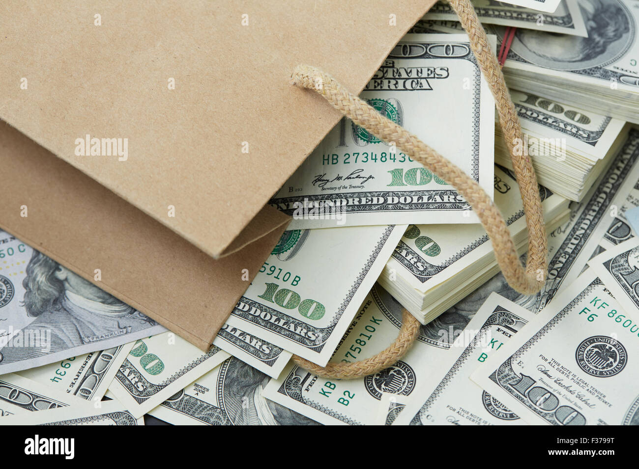 a lot of money out of a paper bag Stock Photo - Alamy