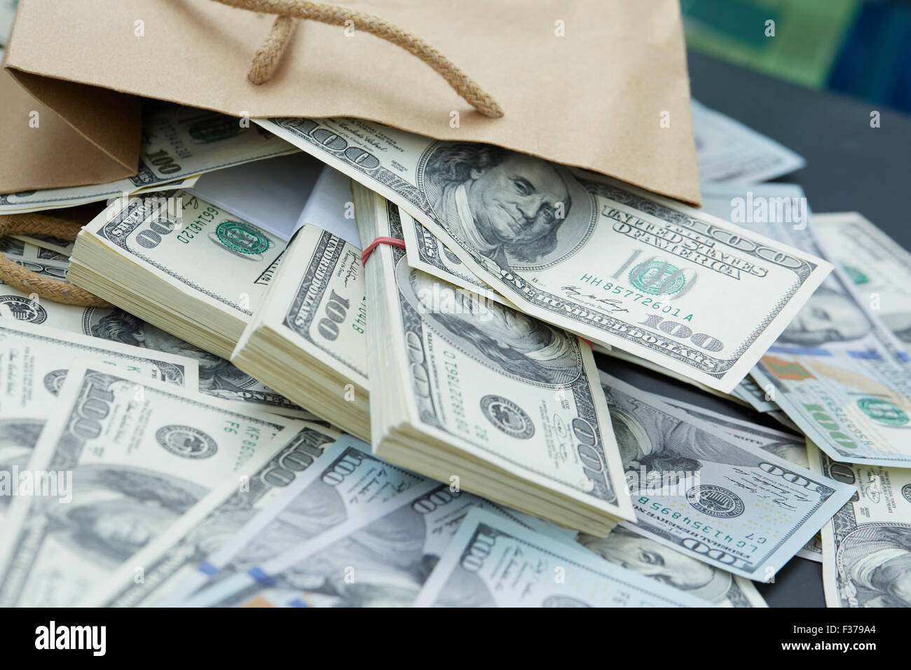 a lot of money out of a paper bag Stock Photo - Alamy