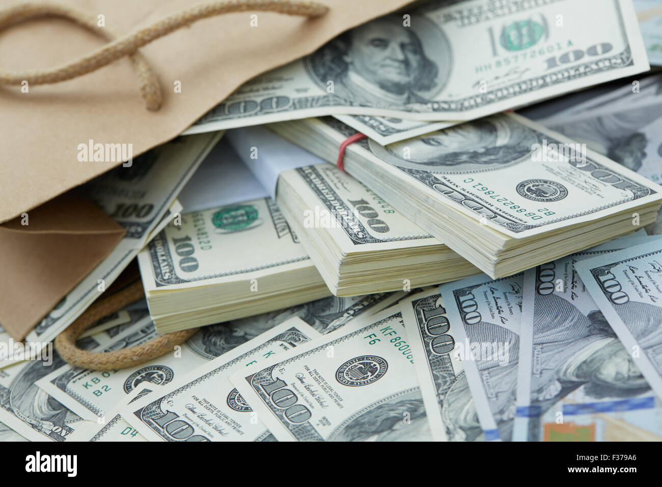 a lot of money out of a paper bag Stock Photo - Alamy