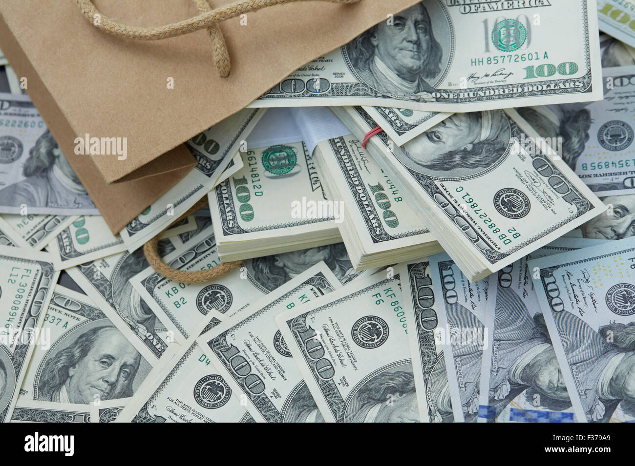 a lot of money out of a paper bag Stock Photo - Alamy