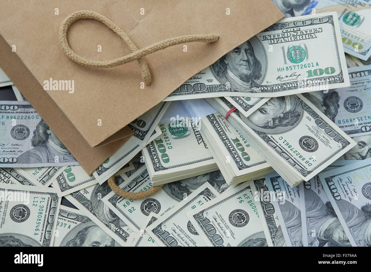 a lot of money out of a paper bag Stock Photo - Alamy