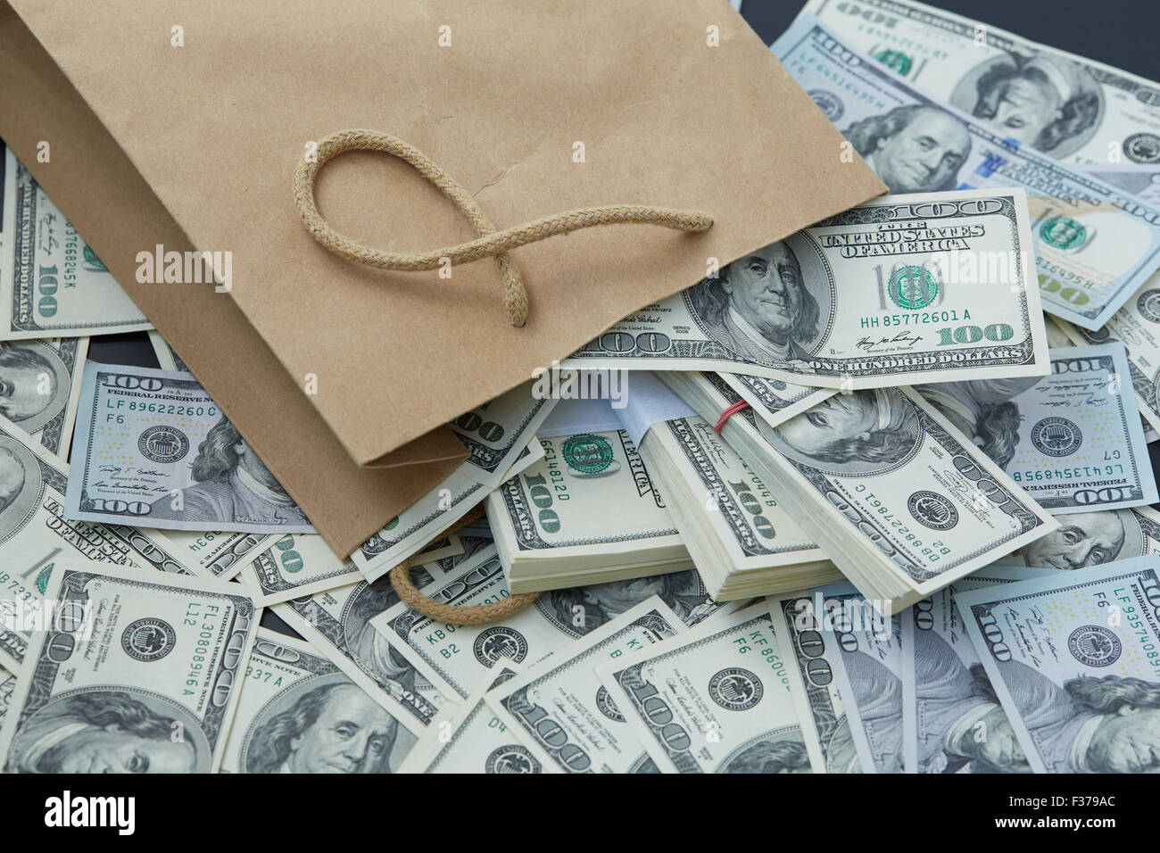 a lot of money out of a paper bag Stock Photo - Alamy