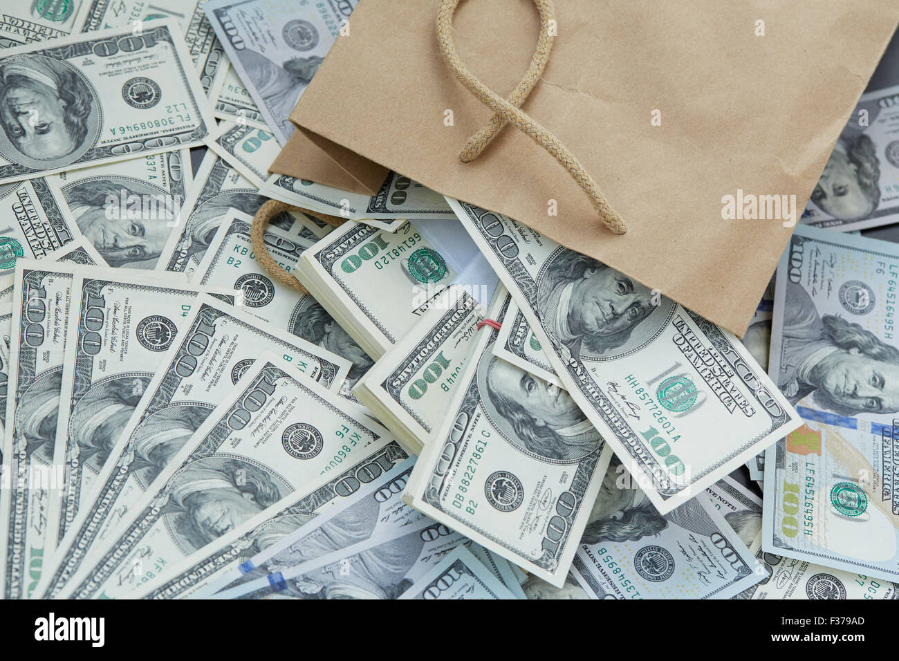 a lot of money out of a paper bag Stock Photo - Alamy