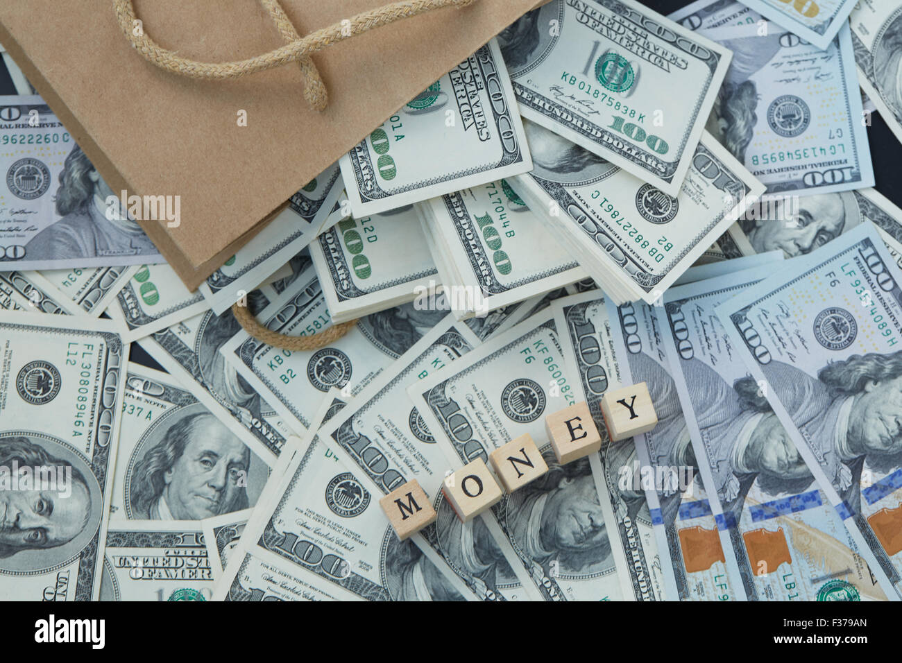 Wooden blocks - the inscription money. a lot of money out of a paper ...