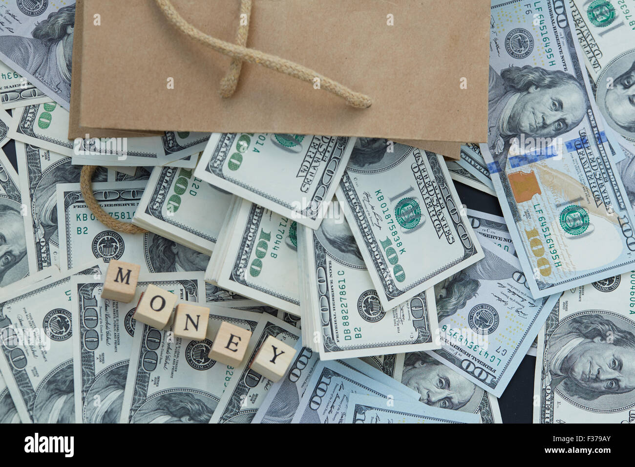 Wooden blocks - the inscription money. a lot of money out of a paper ...