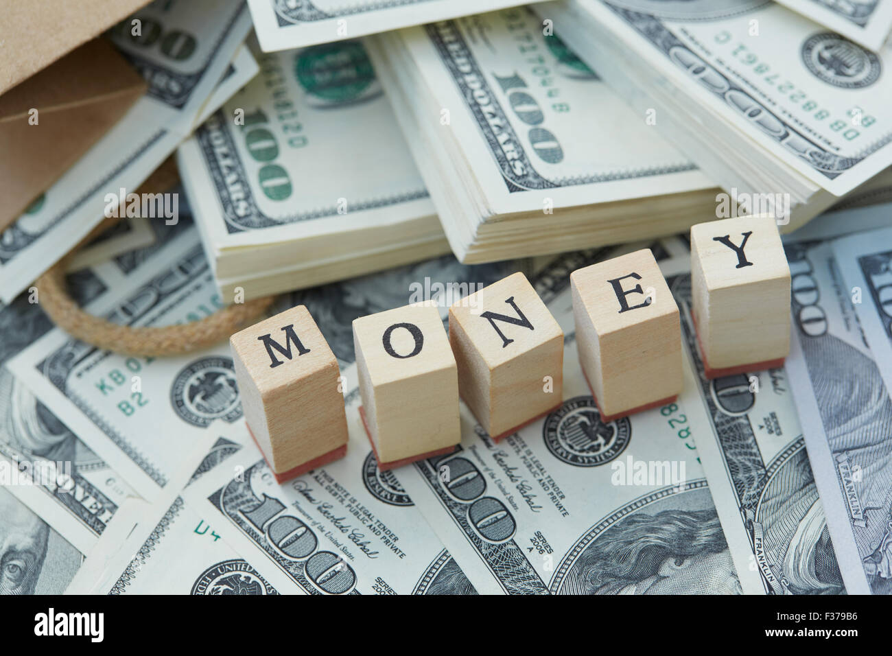 Wooden blocks - the inscription money. a lot of money out of a paper ...