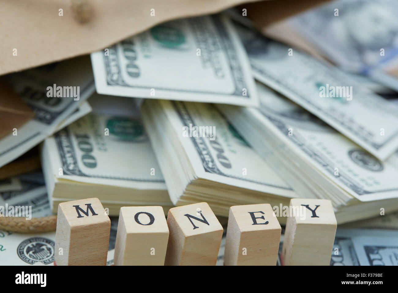 Wooden blocks - the inscription money. a lot of money out of a paper ...