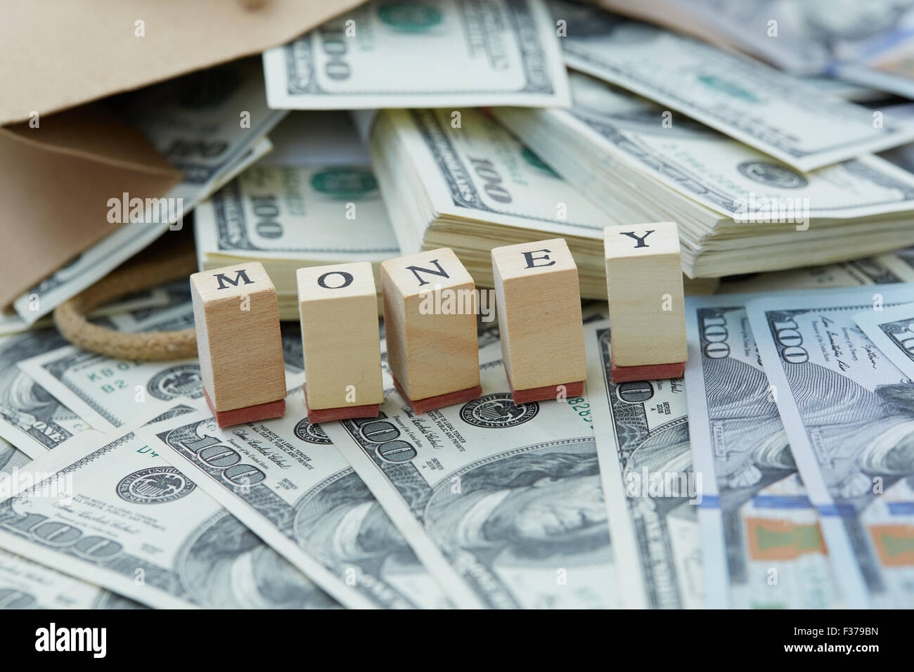 Wooden blocks - the inscription money. a lot of money out of a paper ...
