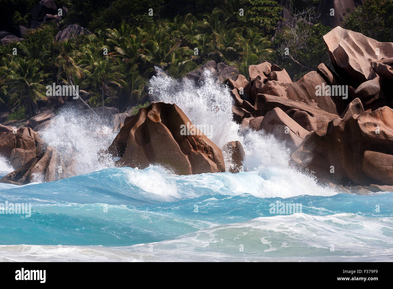 Strong surf, churning sea, granite rocks, Grand Anse, La Digue Island ...