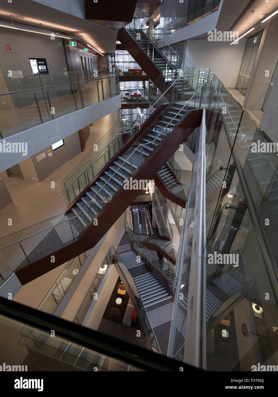 Looking down in atrium showing angled stairs and multiple levels ...