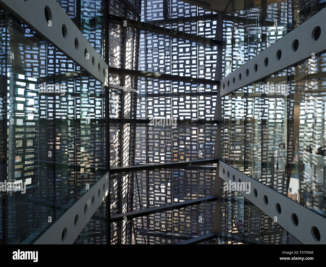 Atrium with office, exterior screen and filtered view beyond. Faculty ...