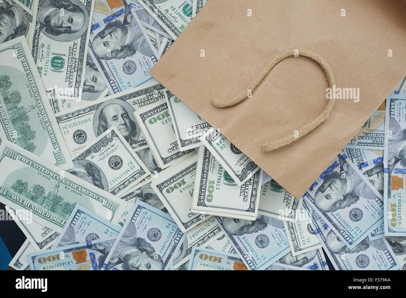 much money out of a paper bag Stock Photo - Alamy