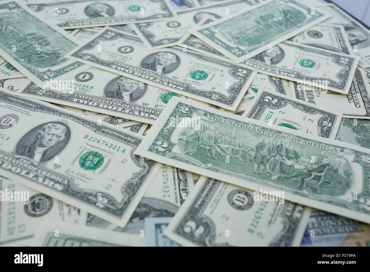 banknotes to two and one hundred USD Stock Photo - Alamy