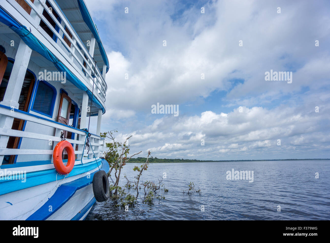 Touristic boat in amazon river Stock Photo - Alamy