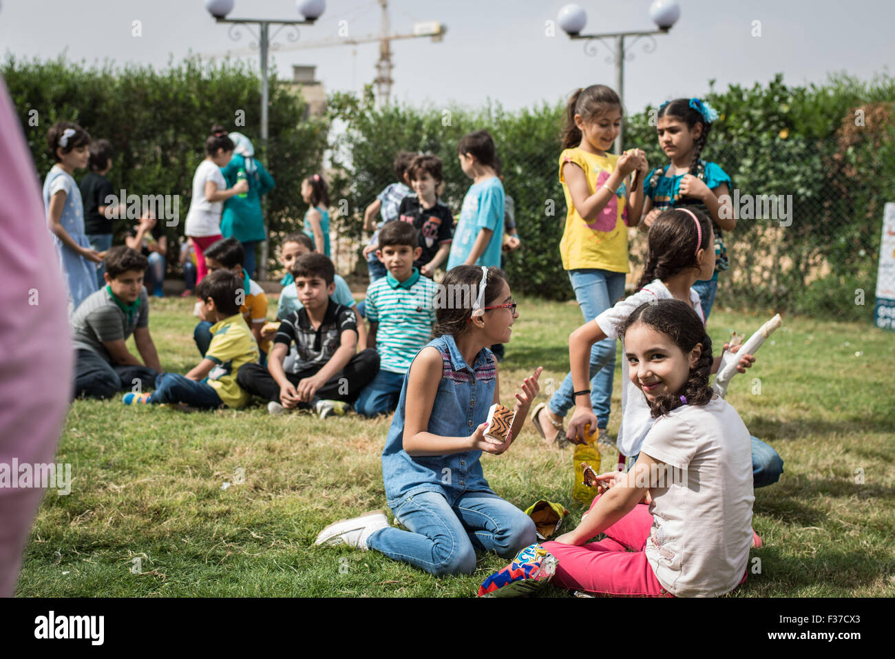 Cairo, Egypt. 30th Sep, 2015. Syrian kids have fun on the playground ...