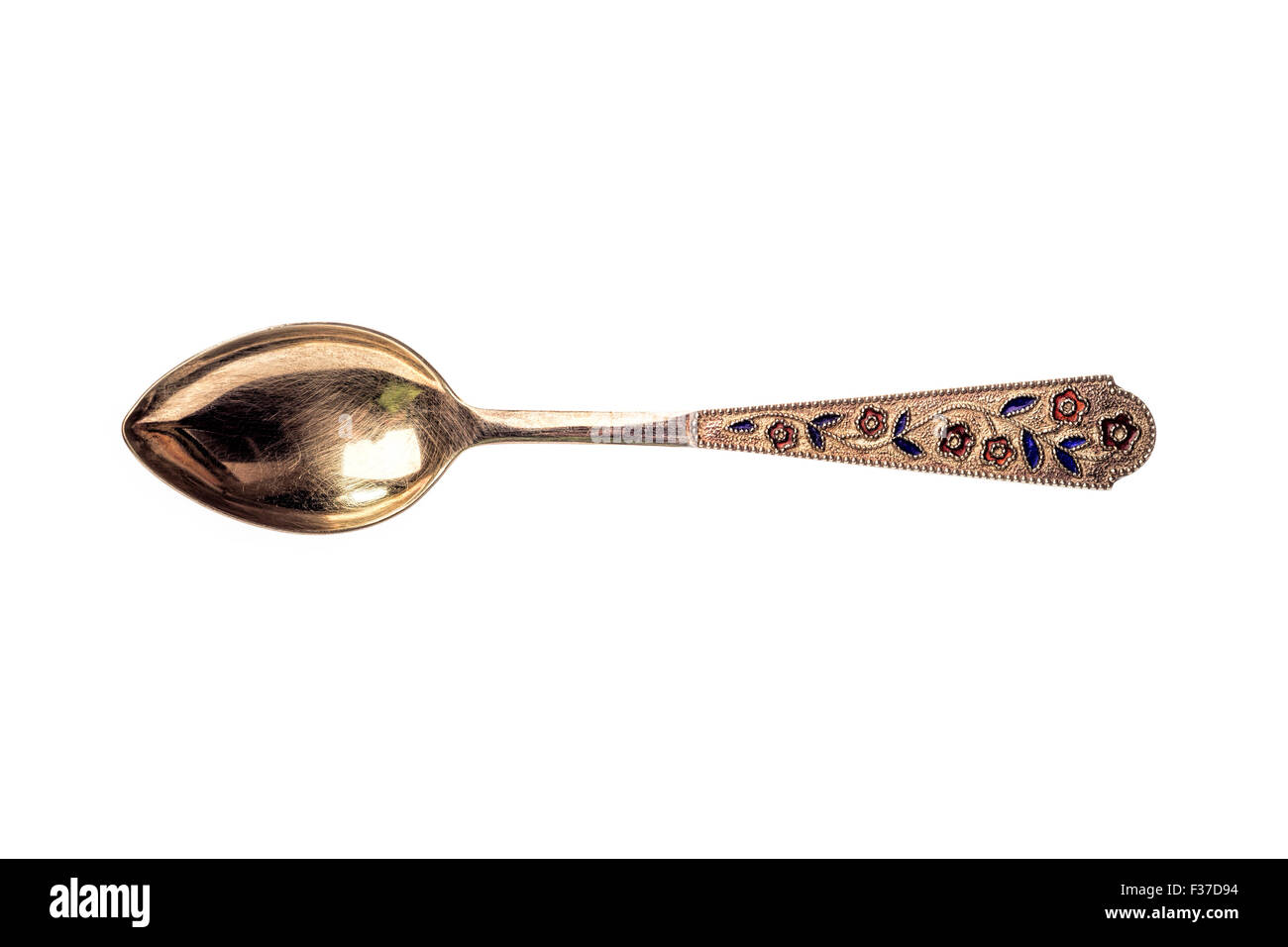 A soviet style silver decorated tea spoon isolated on white background ...